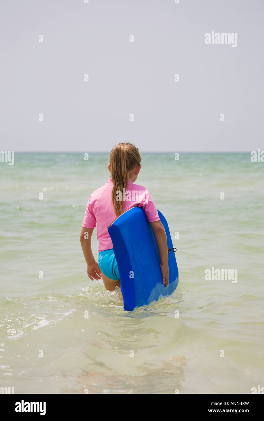 Girl with boogie board hi-res stock photography and images - Alamy