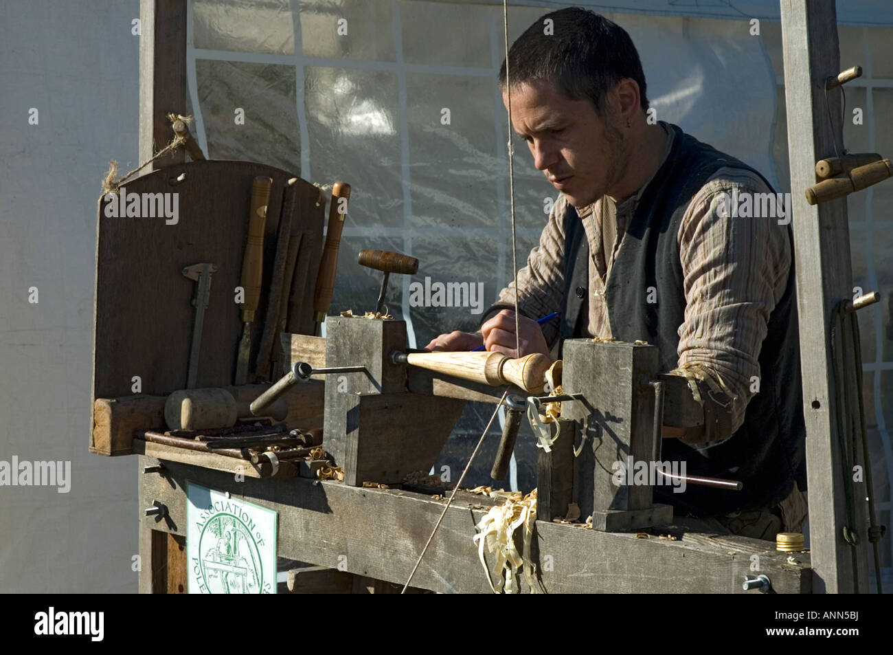 Craftsman demonstrating wood turning using a pole lathe Stock Photo - Alamy