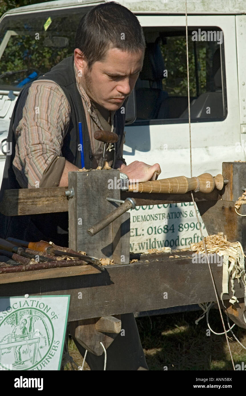 Craftsman demonstrating wood turning using a pole lathe Stock Photo - Alamy