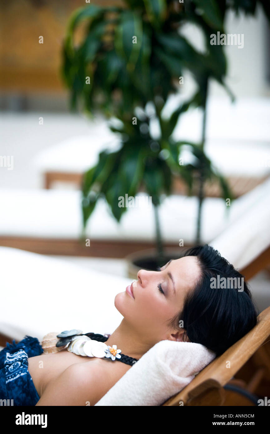 woman relaxing on deckchair Stock Photo - Alamy