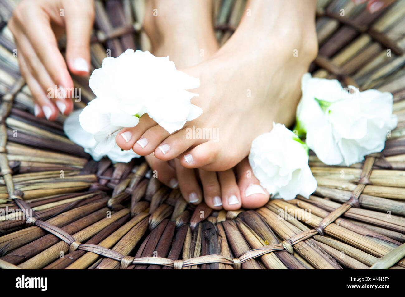 Feet with flowers Stock Photo - Alamy