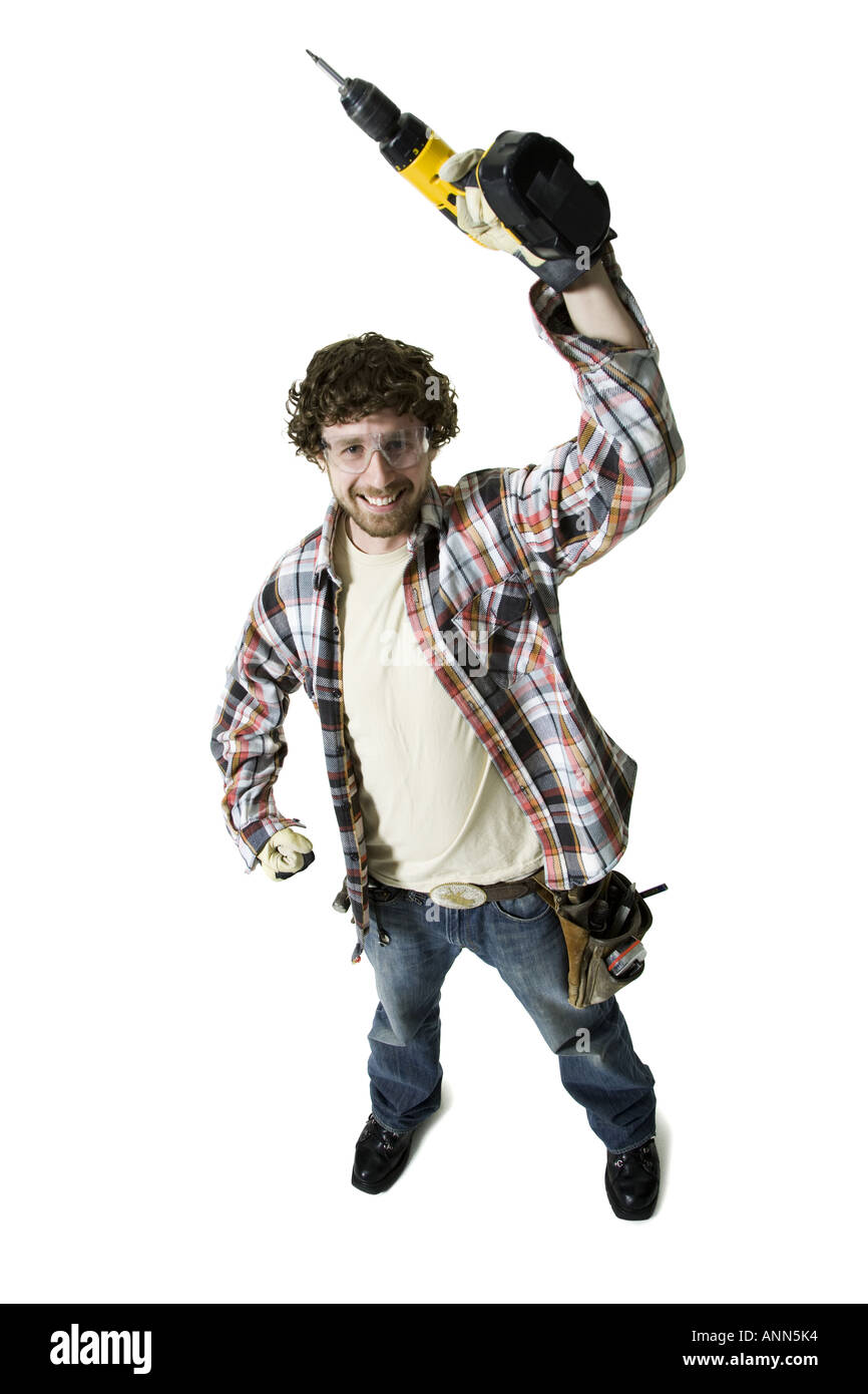 High angle view of a carpenter holding up a drill Stock Photo - Alamy