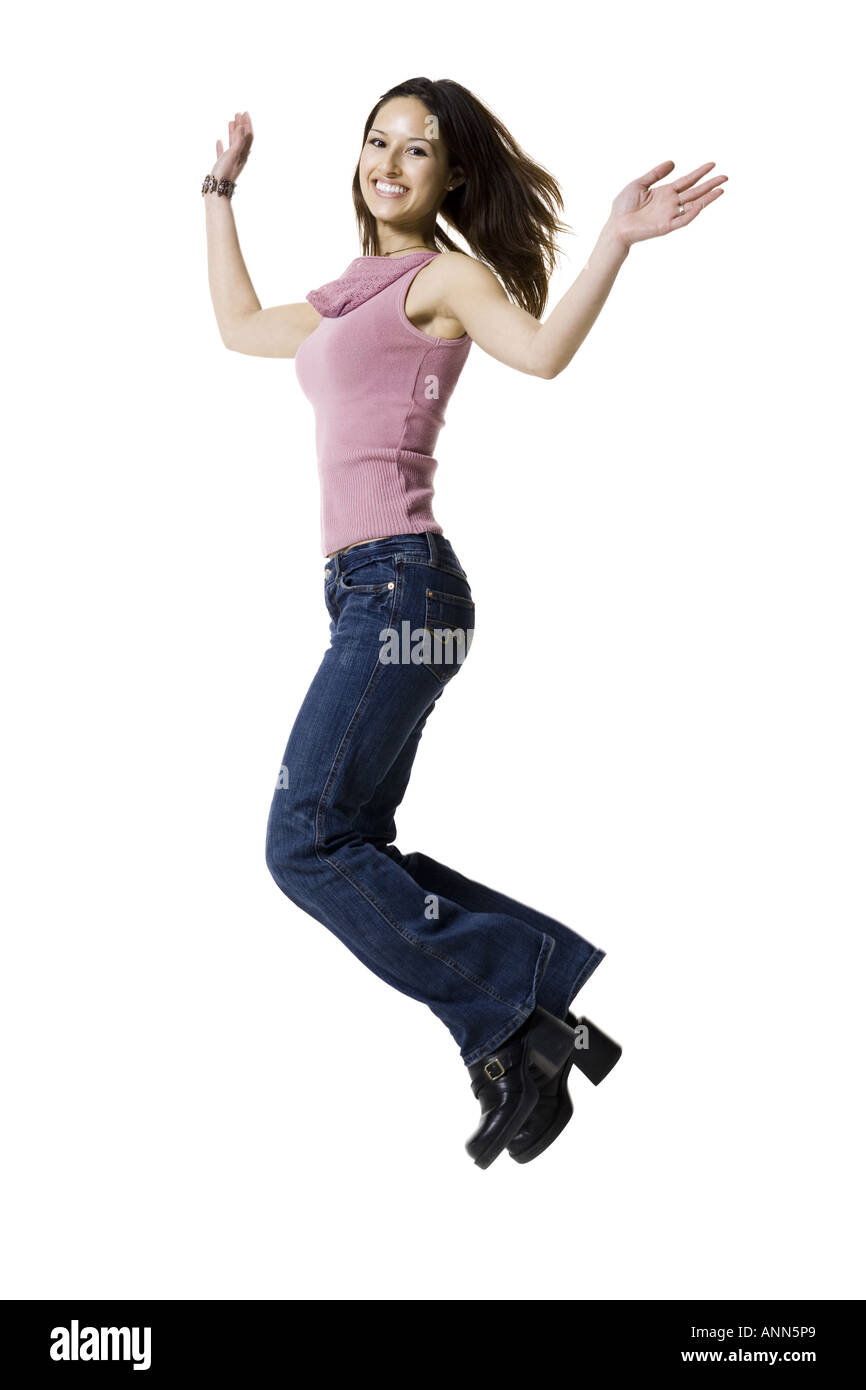 Portrait of a woman jumping in mid air Stock Photo - Alamy