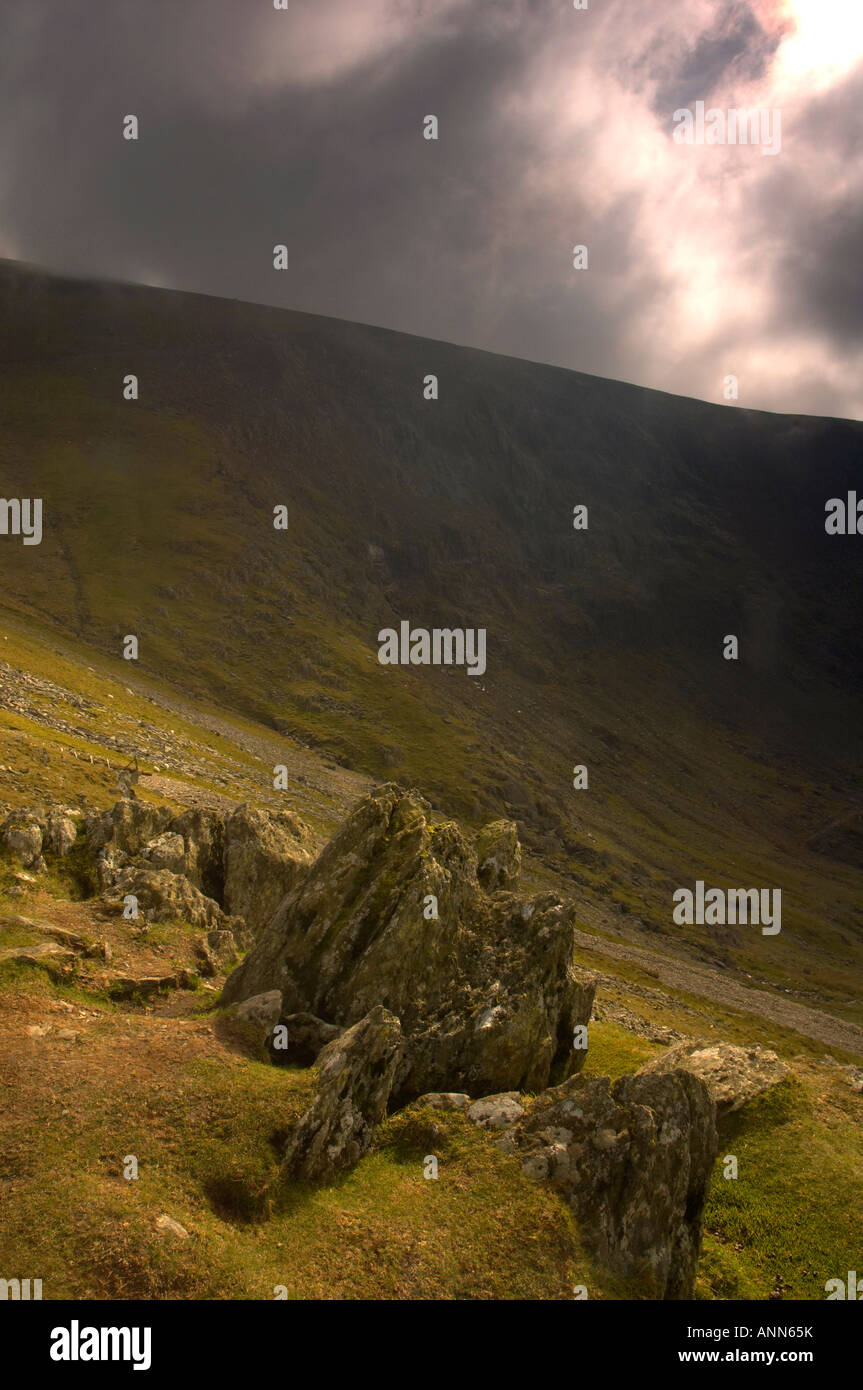 The summit of Snowdon looming through heavy rain clouds Snowdonia Wales ...