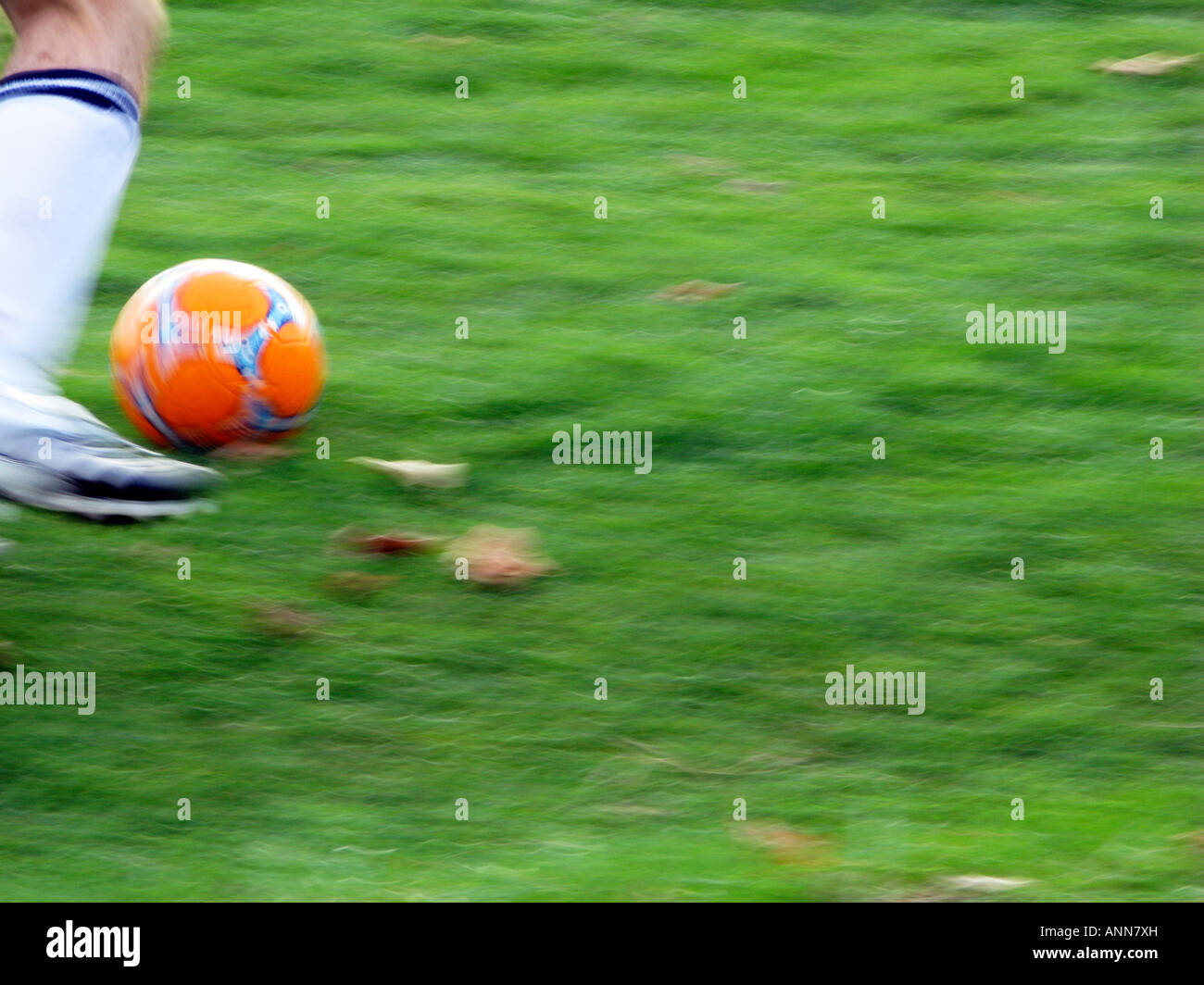 Abstract shot of a man receiving a passed football Stock Photo - Alamy