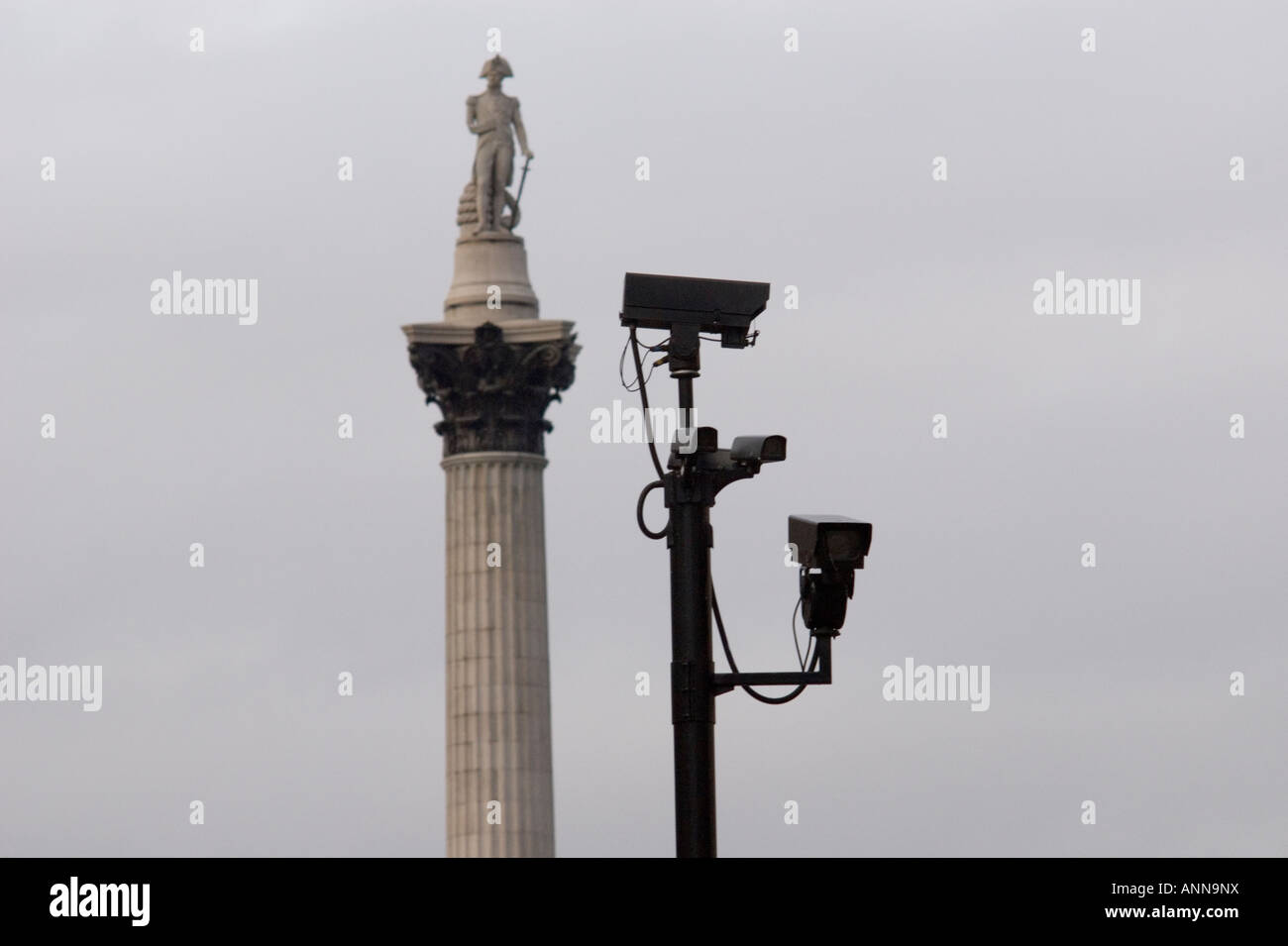 looking up at three cctv cameras with Nelsons column in background grey ...