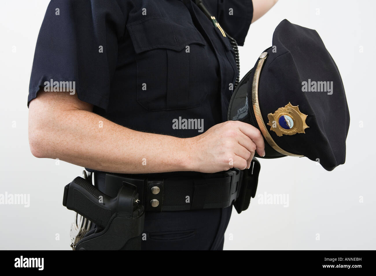 Close up of a police sergeant holding a cap Stock Photo - Alamy
