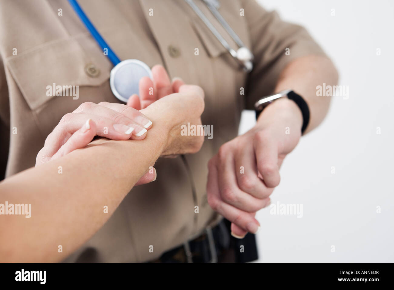 View of Emergency Medical Service officer checking the pulse of a ...