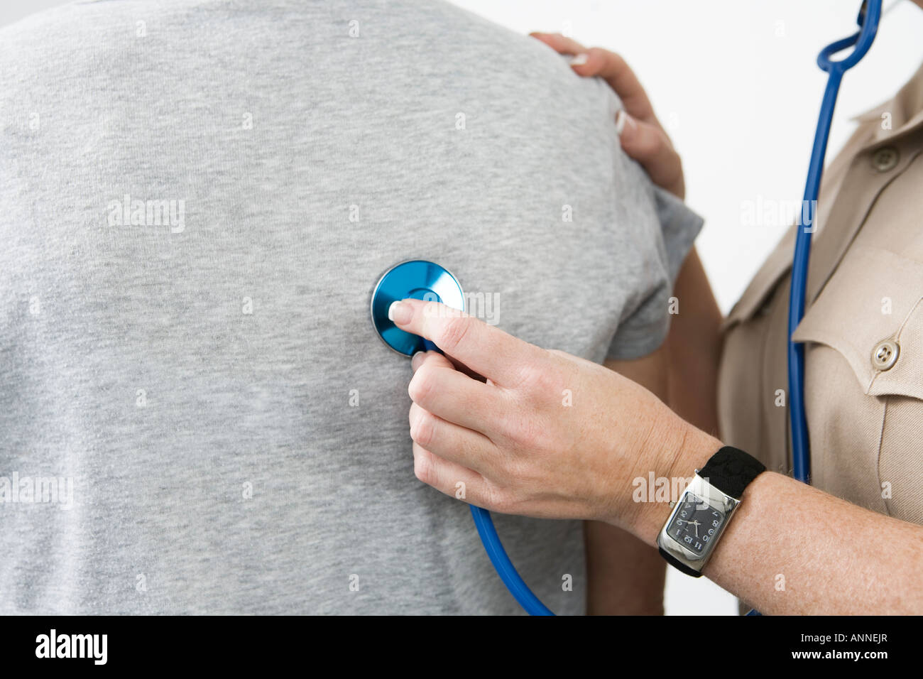 Emergency Medical Service officer checking pulse of a patient Stock ...