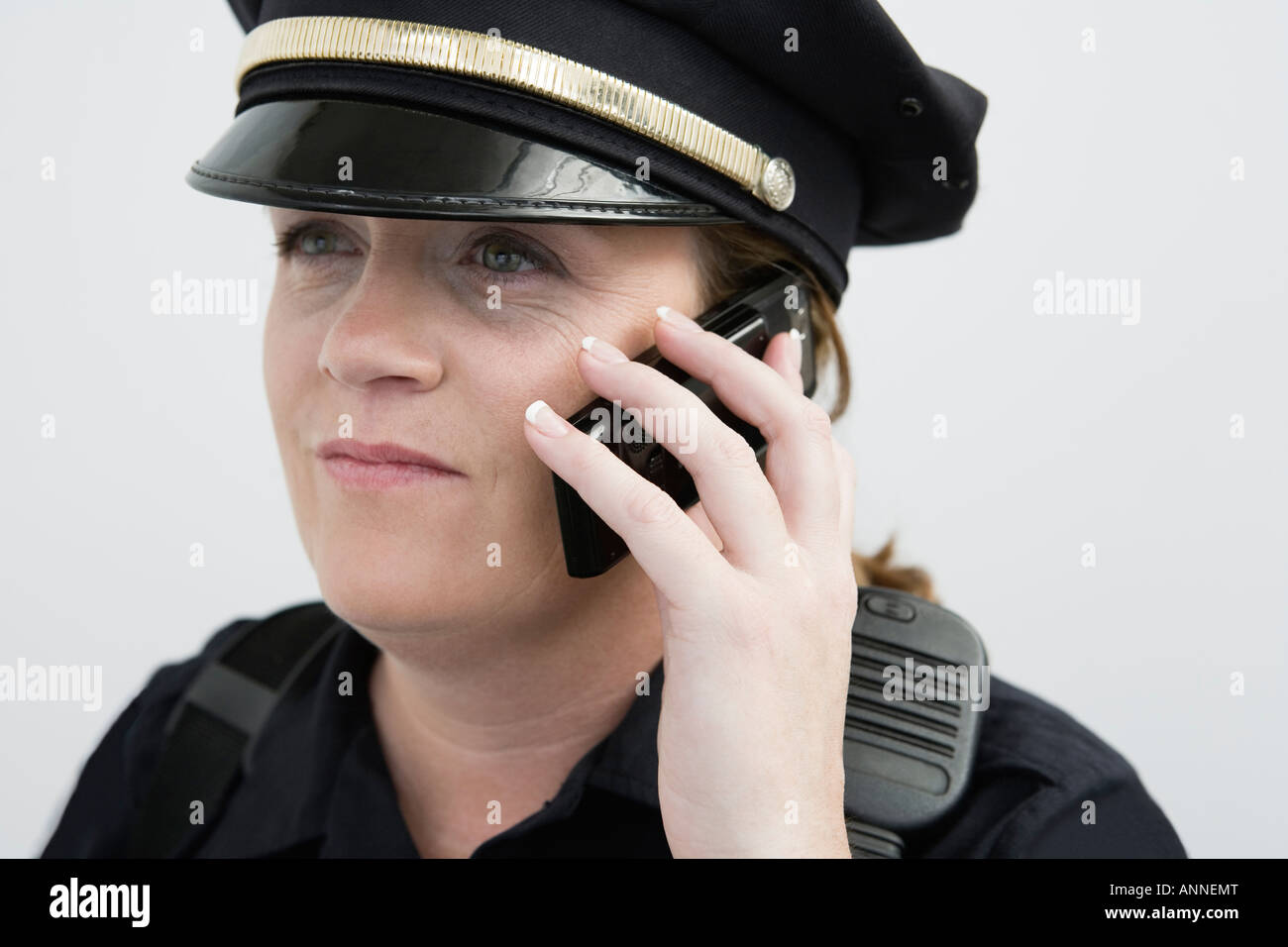 View of a police woman talking on the mobile phone Stock Photo - Alamy