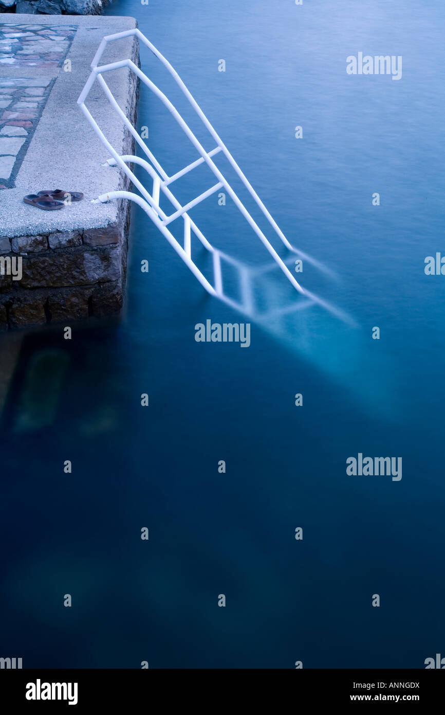 Steps from a quay leading into the sea Stock Photo - Alamy