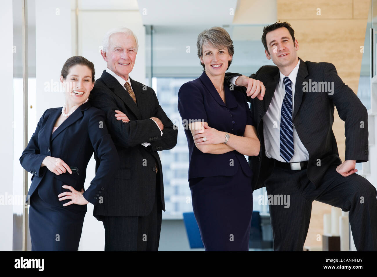 Portrait of businesspeople smiling in an office Stock Photo - Alamy