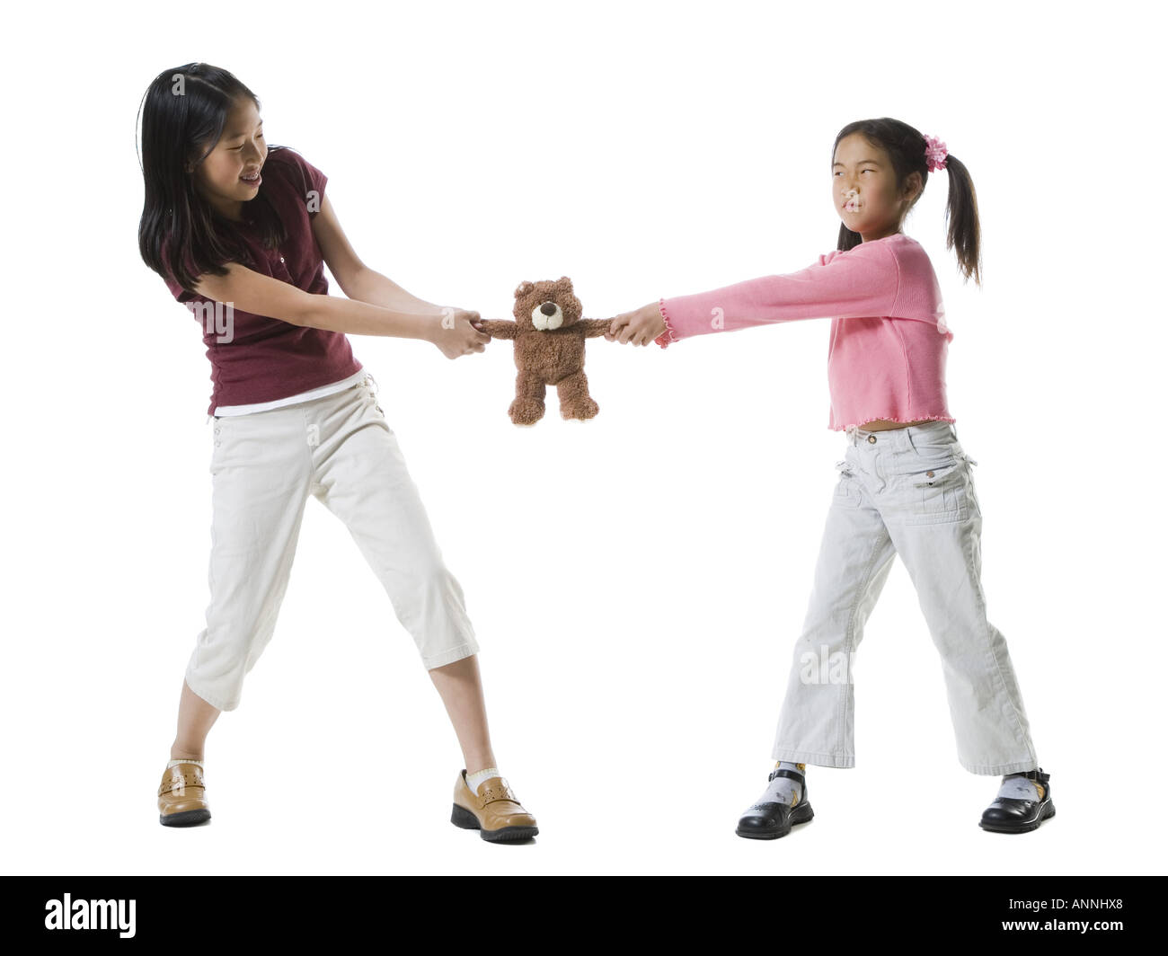 Girls fighting over doll Cut Out Stock Images & Pictures - Alamy