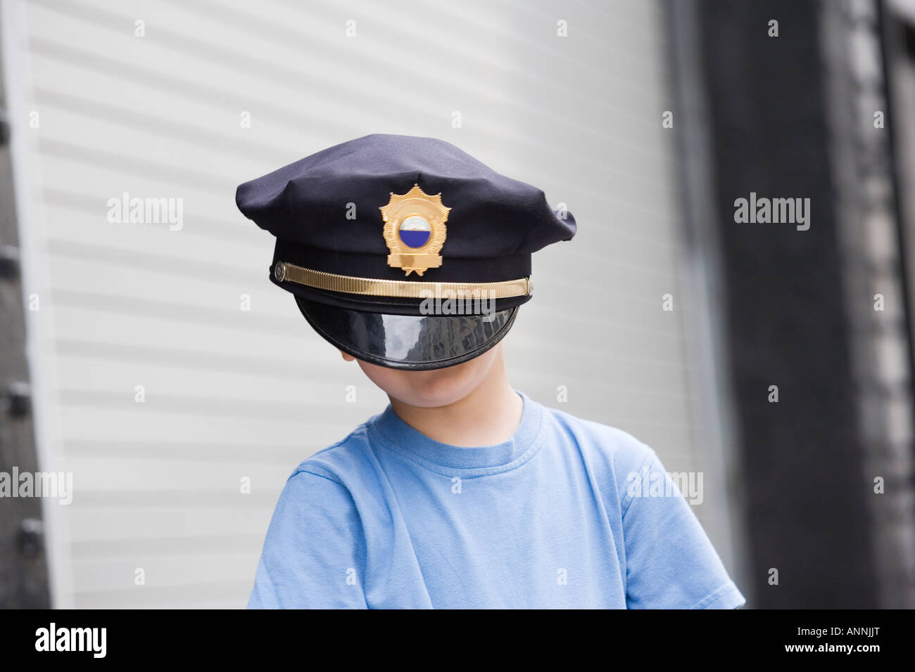 Boy wearing police cap Stock Photo - Alamy