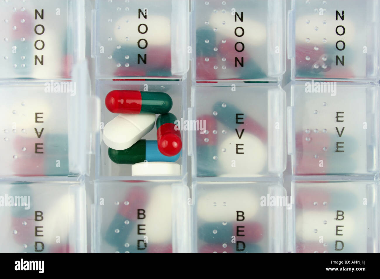 pills in daily pill boxes Stock Photo - Alamy