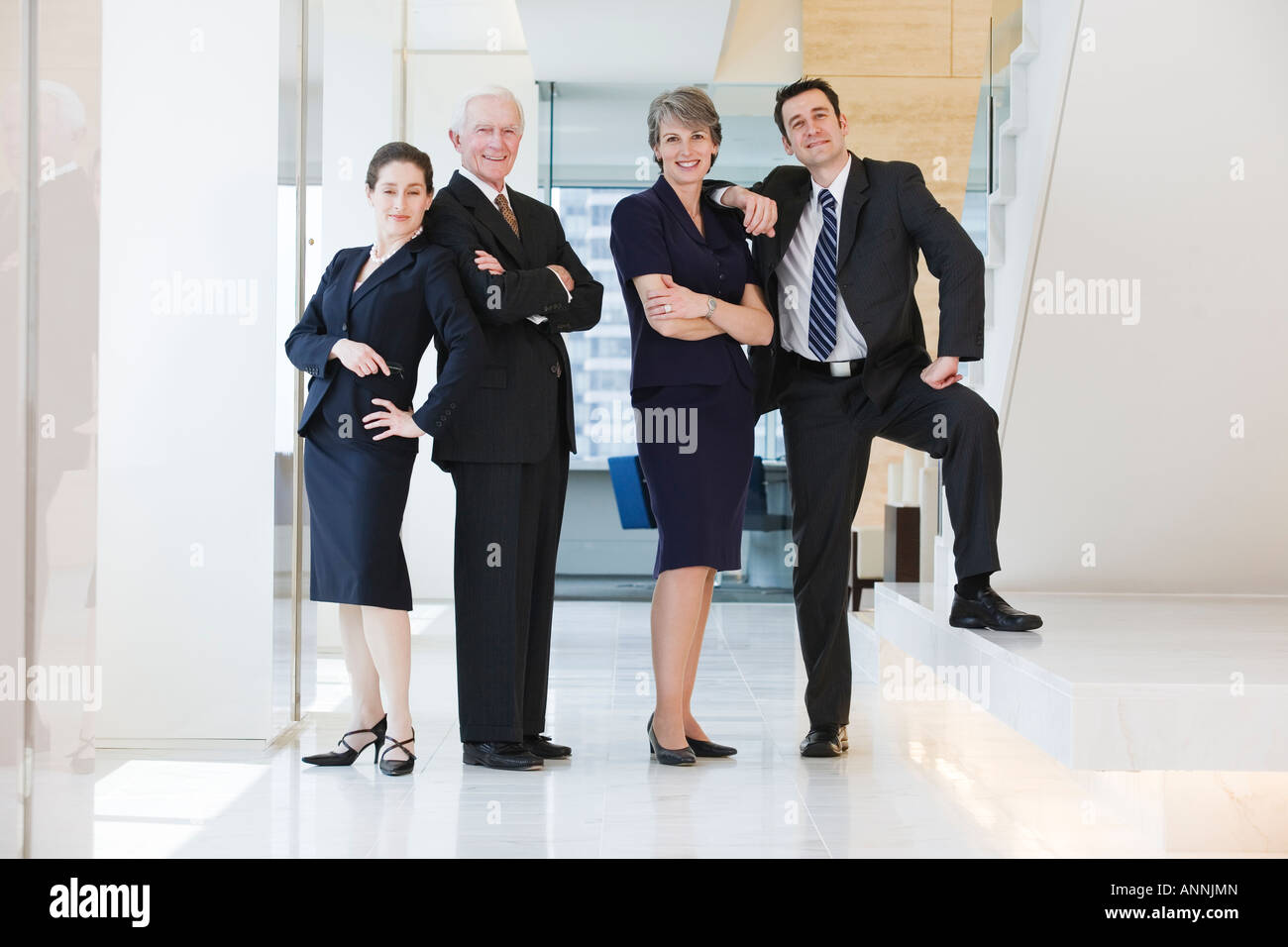 Portrait of businesspeople smiling in an office Stock Photo - Alamy