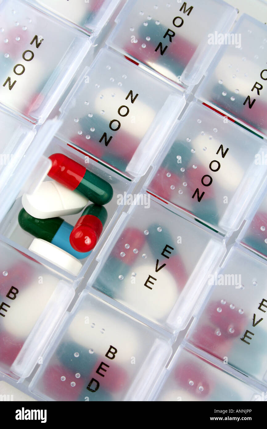 pills in daily pill boxes Stock Photo - Alamy