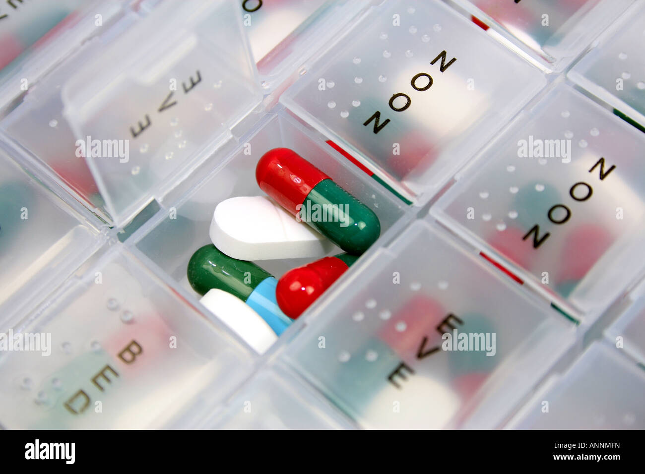 pills in daily pill boxes Stock Photo - Alamy