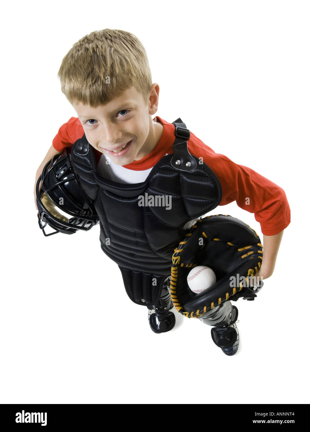 High angle view of a baseball catcher holding a baseball helmet and a ...