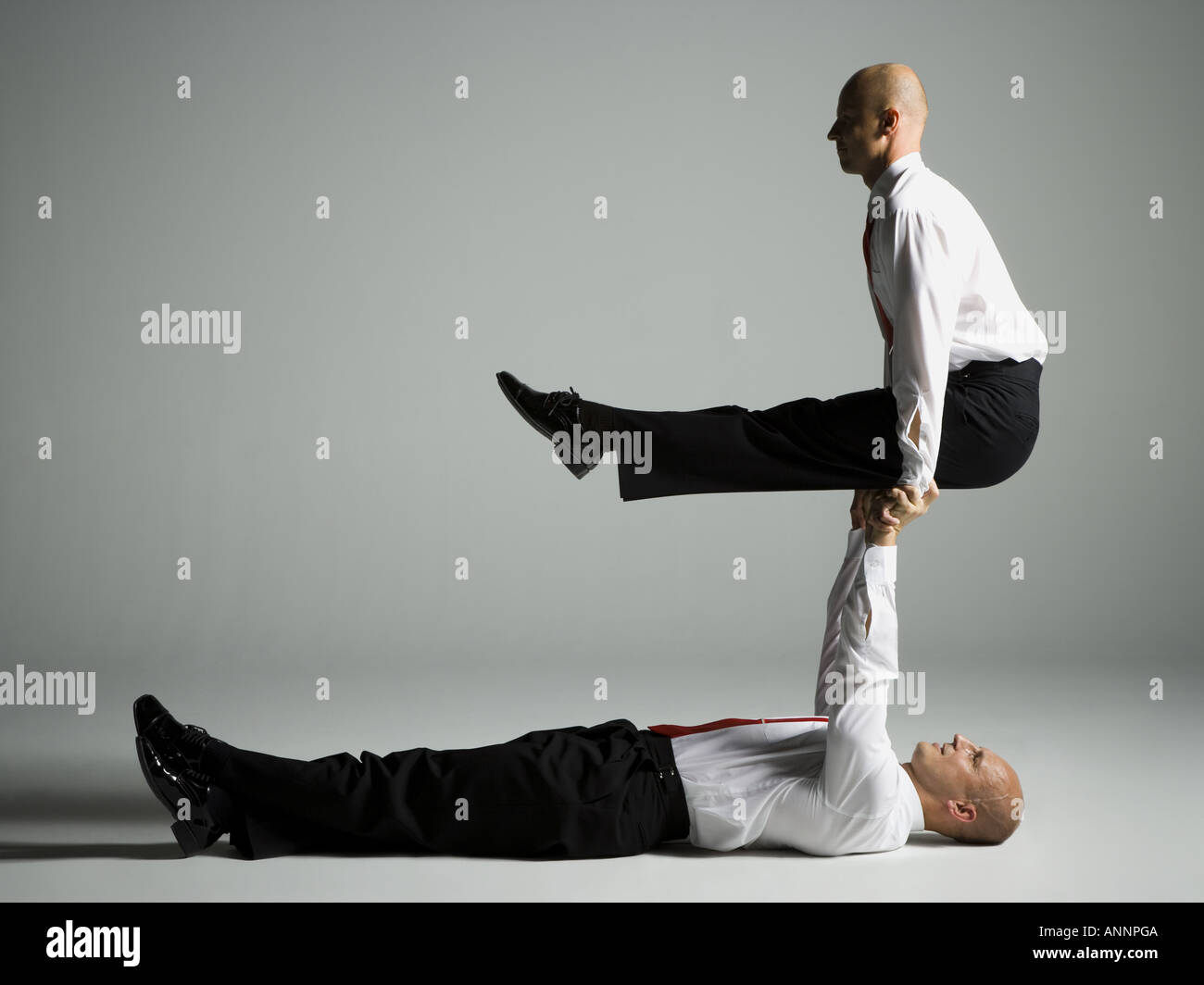 Acrobats performing on trapeze acrobats hi-res stock photography and ...