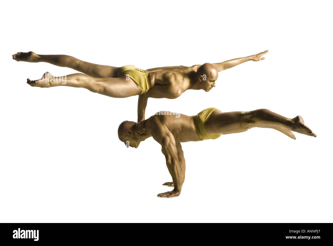 Profile of two male acrobats performing Stock Photo - Alamy