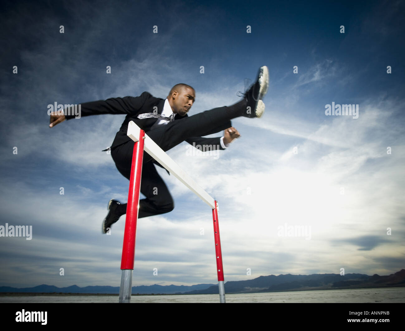 Businessman jumping over hurdle hi-res stock photography and images - Alamy