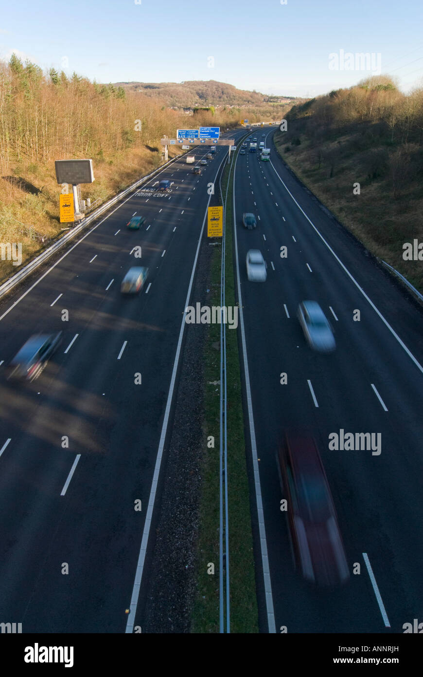 Vertical aerial view of lots of traffic speeding along the M4 motorway ...