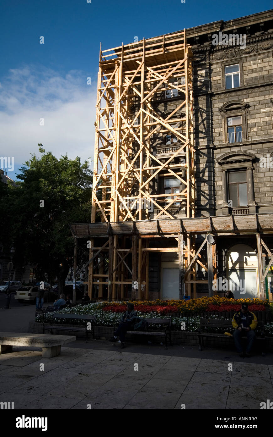 Extraordinarily heavy timber beams used as scaffolding for building ...