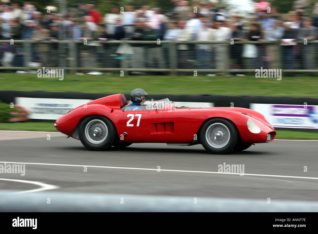 Vintage racing car speeding along track Stock Photo - Alamy