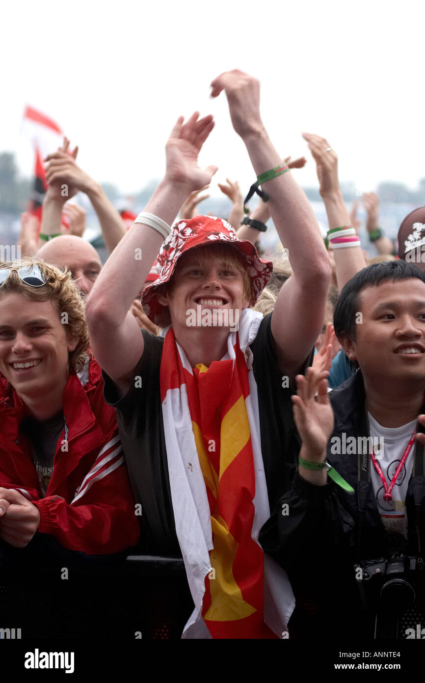 Crowds of fans in the audience clapping and applauding The Doves at ...