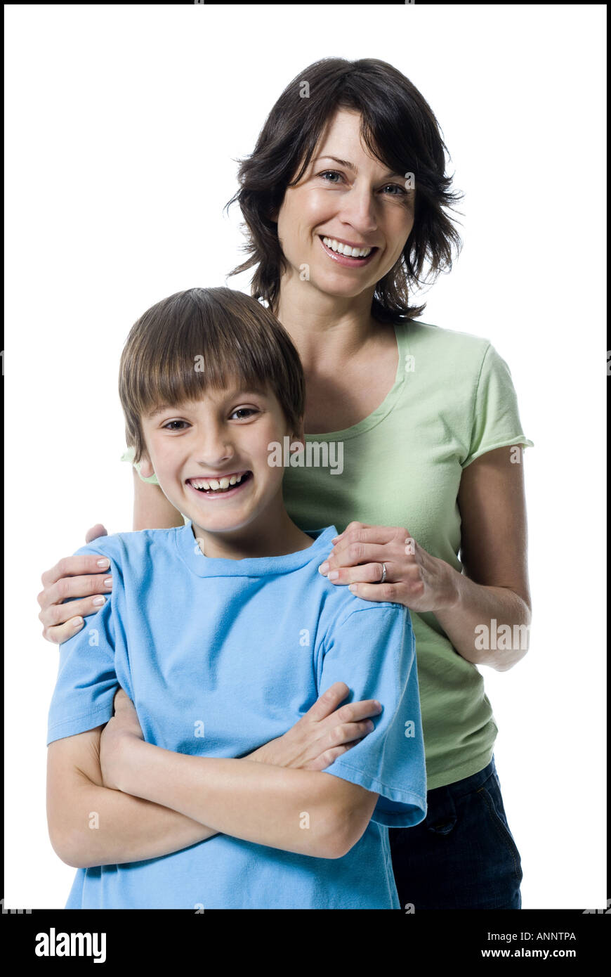 Portrait of a boy standing with his mother Stock Photo - Alamy