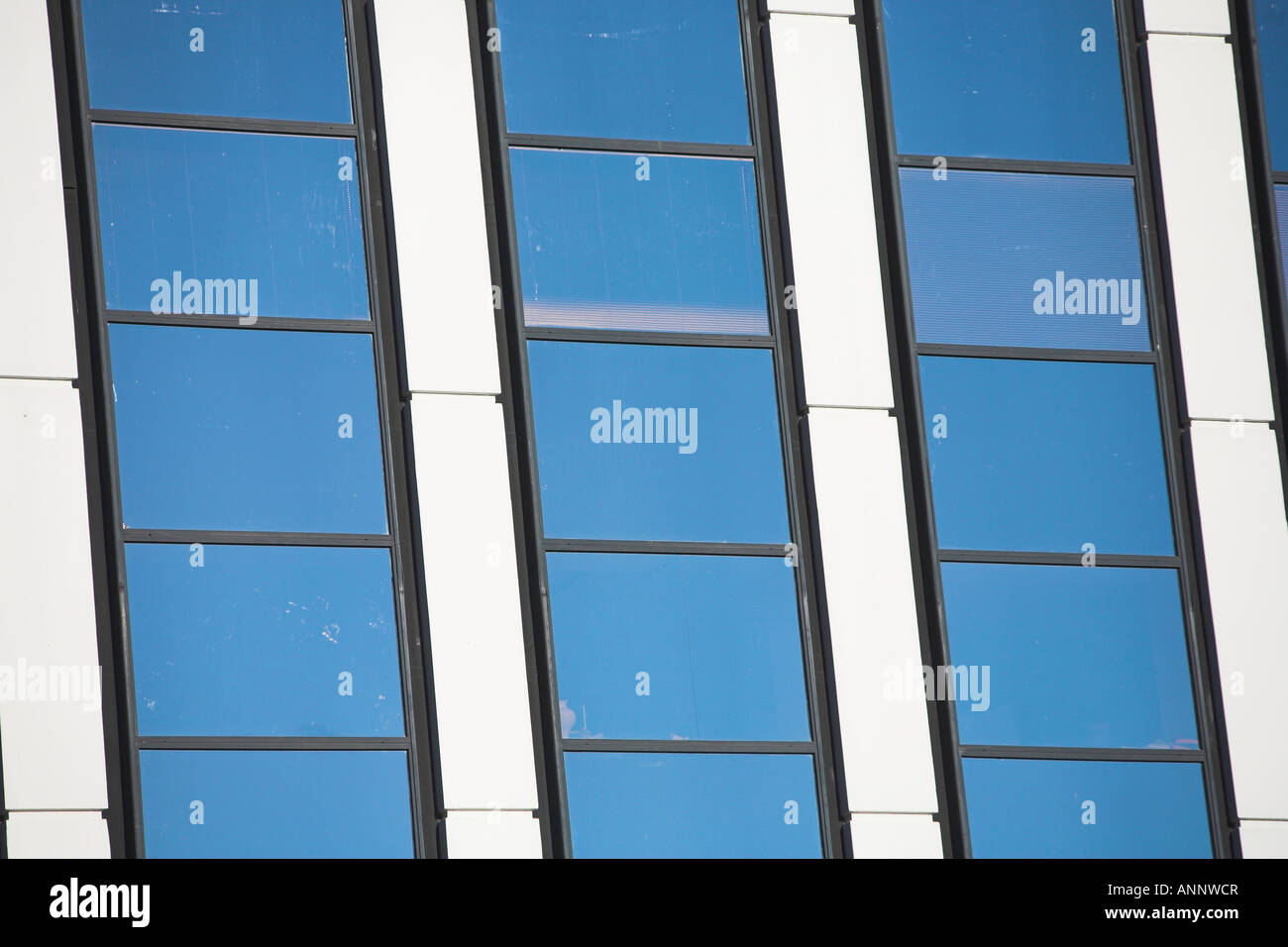Office window block reflecting the blue sky Christchurch Stock Photo ...