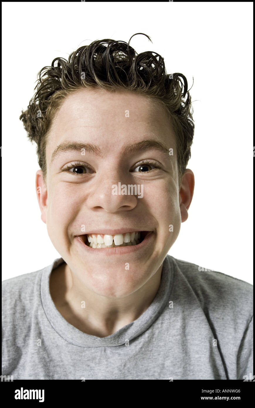Portrait of a teenage boy grinning Stock Photo - Alamy