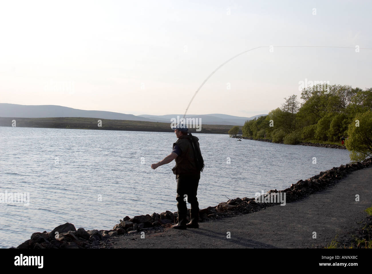 Lough Fea with fisherman casting in the scenic Sperrin Mountains Co ...