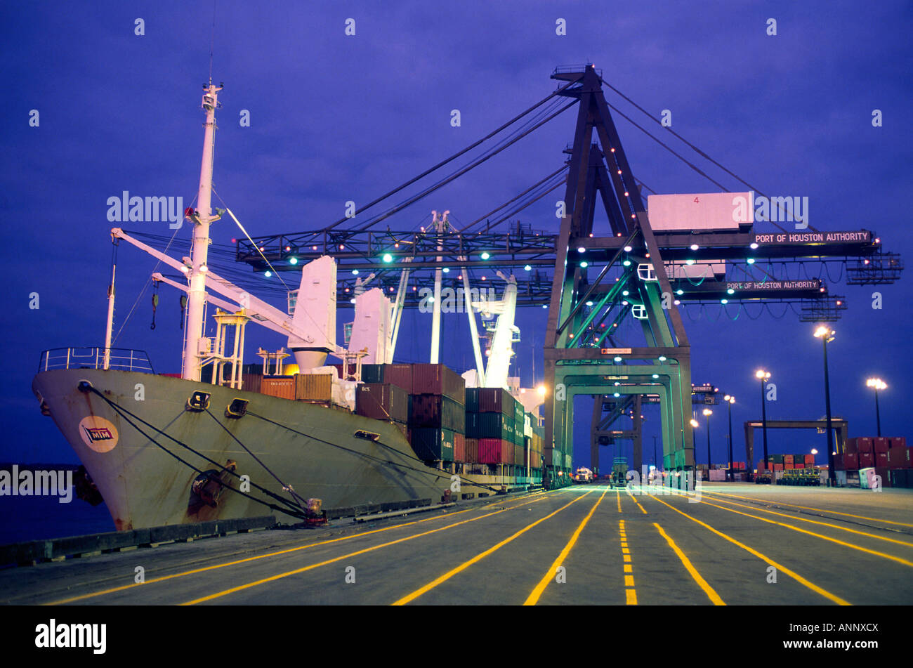 A docked cargo ship and loading cranes Stock Photo - Alamy