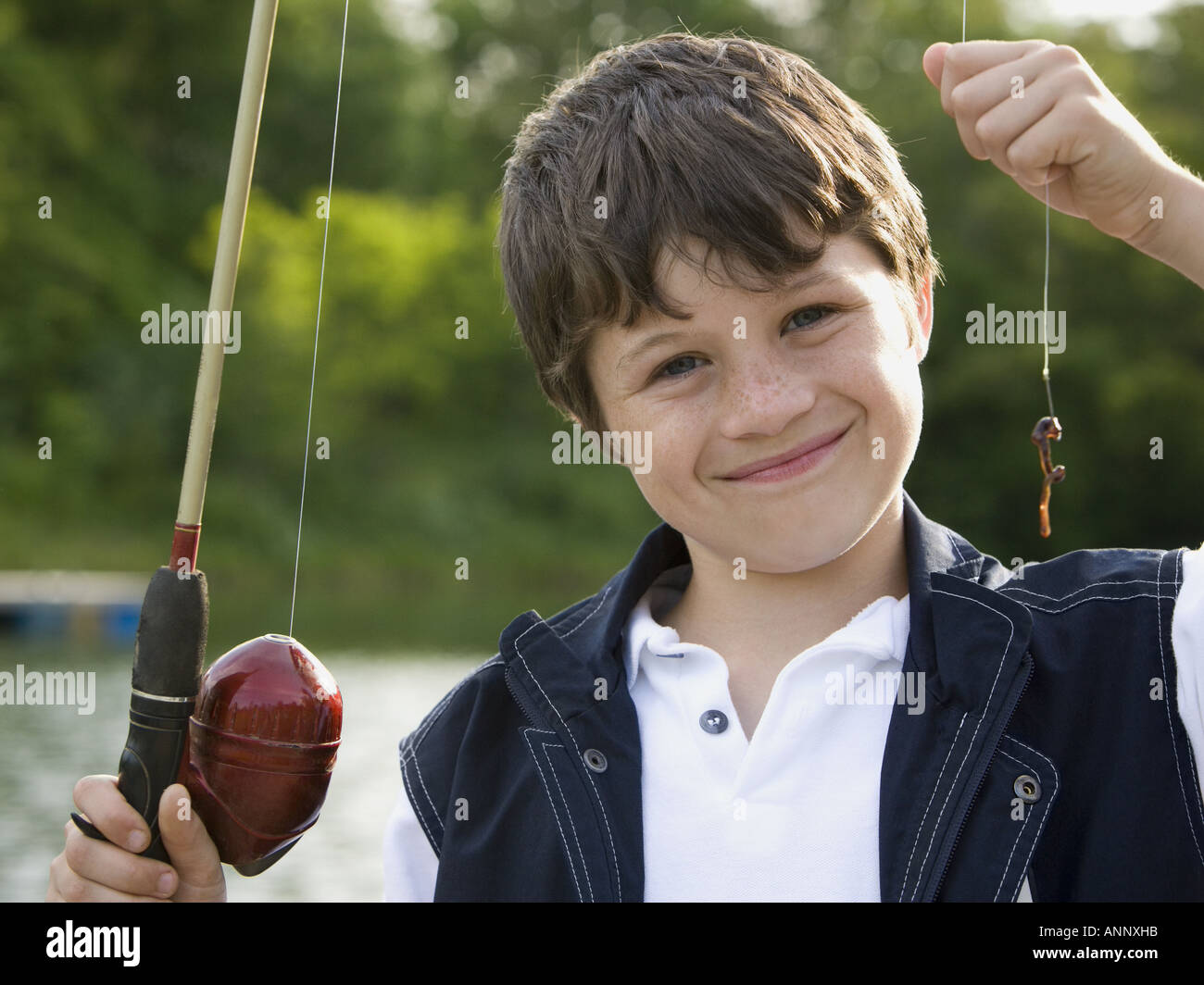 Portrait of a boy fishing Stock Photo - Alamy