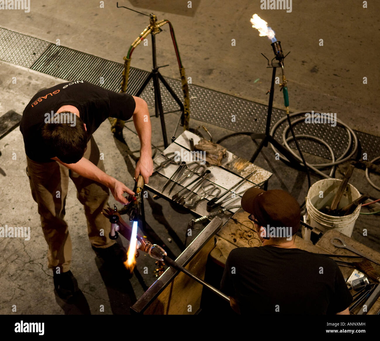 Glassblowers creating blown glass art in the Jane Russell Hot Shop at ...