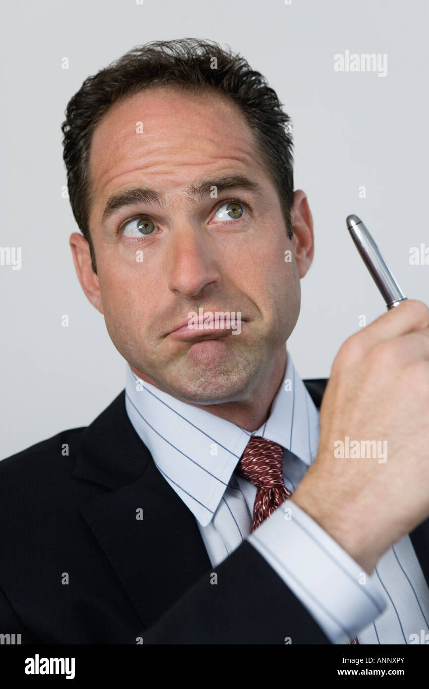 View of an architect thinking and holding a pen Stock Photo - Alamy