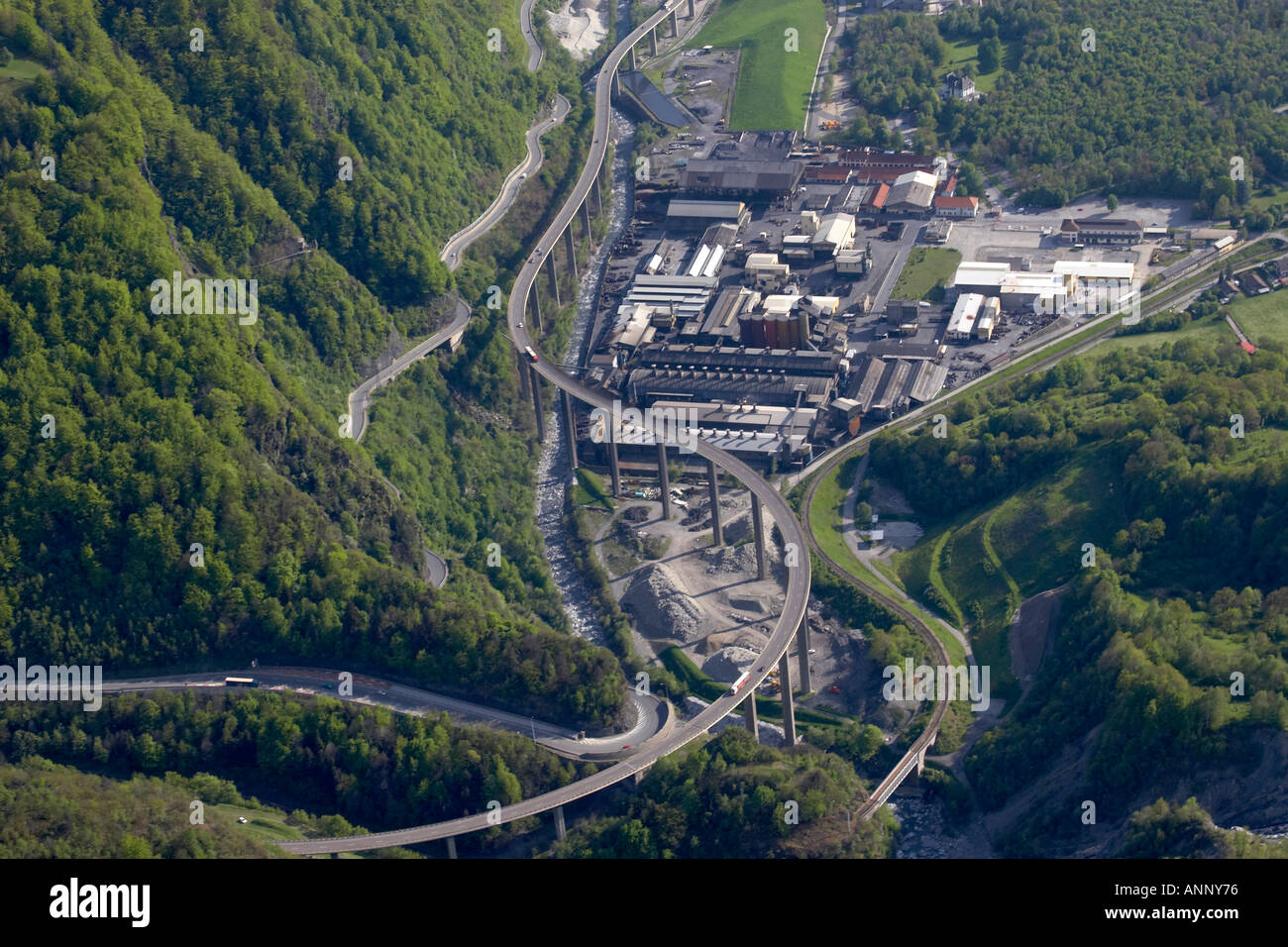 Aerial view of A5 Autoroute high level viaduct bridge with industrial ...