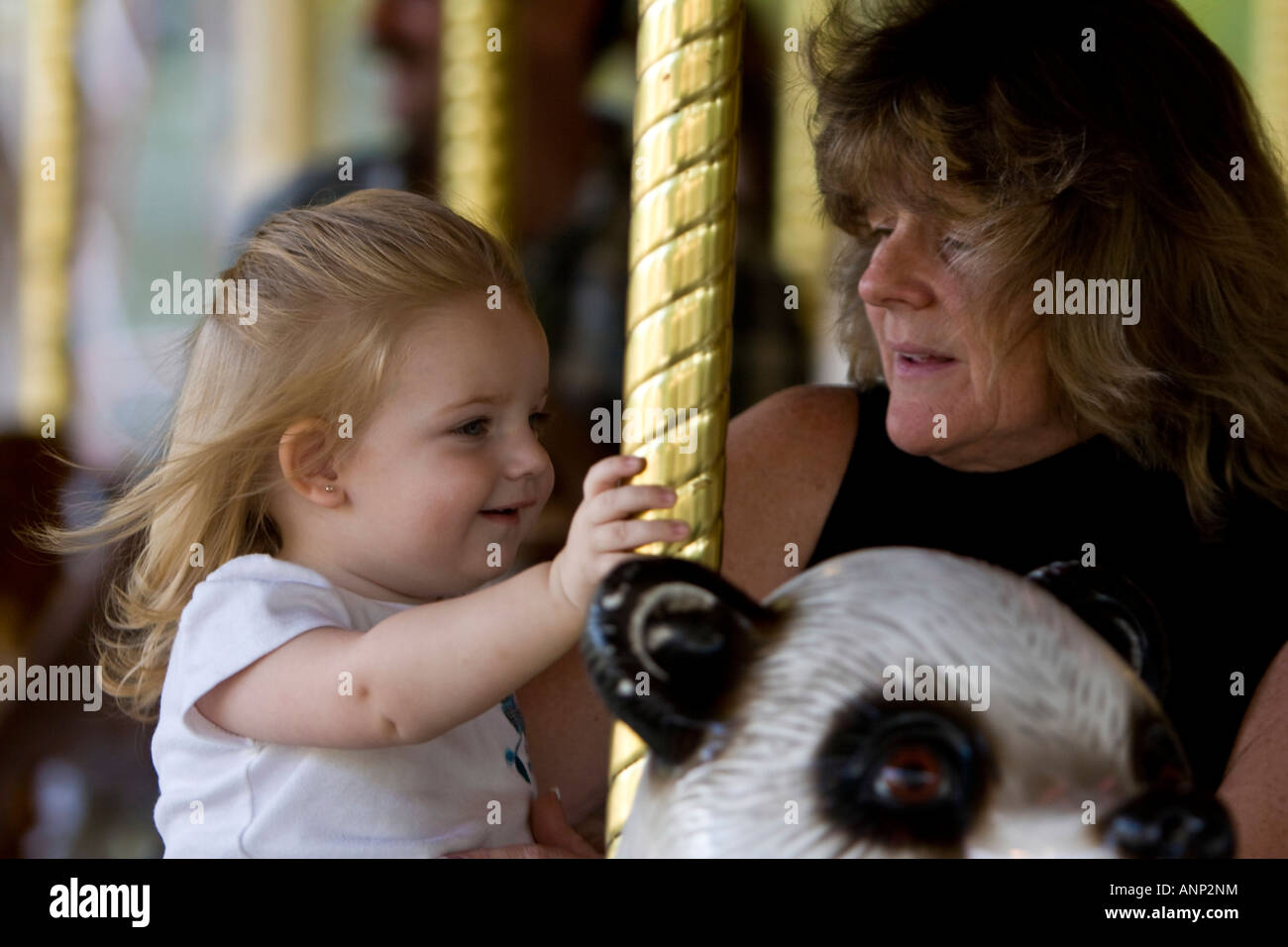 Mother and daughter ride the carousel hi-res stock photography and ...