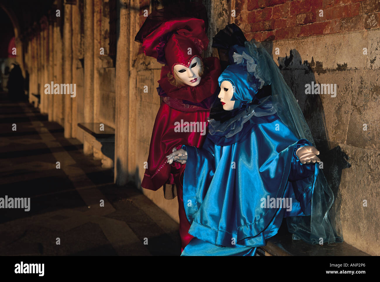 Two people dressed in masquerade costumes Stock Photo - Alamy
