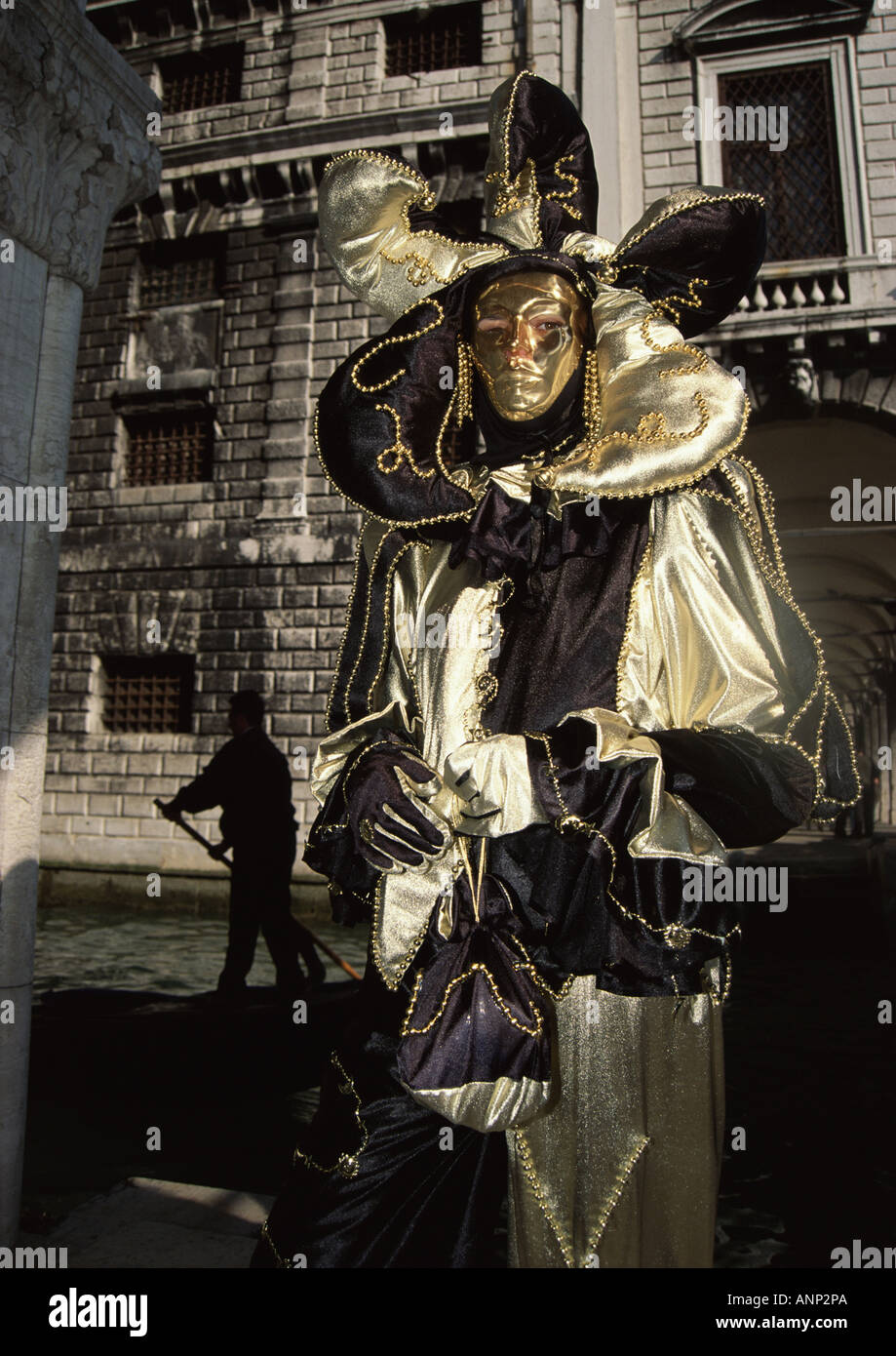 Standing looking at camera holding building exterior headdress hi-res ...