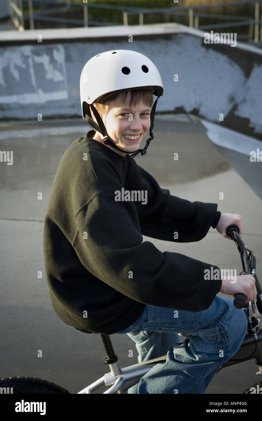 Portrait of a teenage boy cycling Stock Photo - Alamy