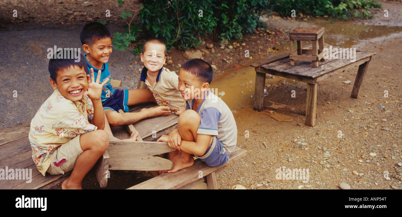 Kids sitting round old table laos hi-res stock photography and images ...