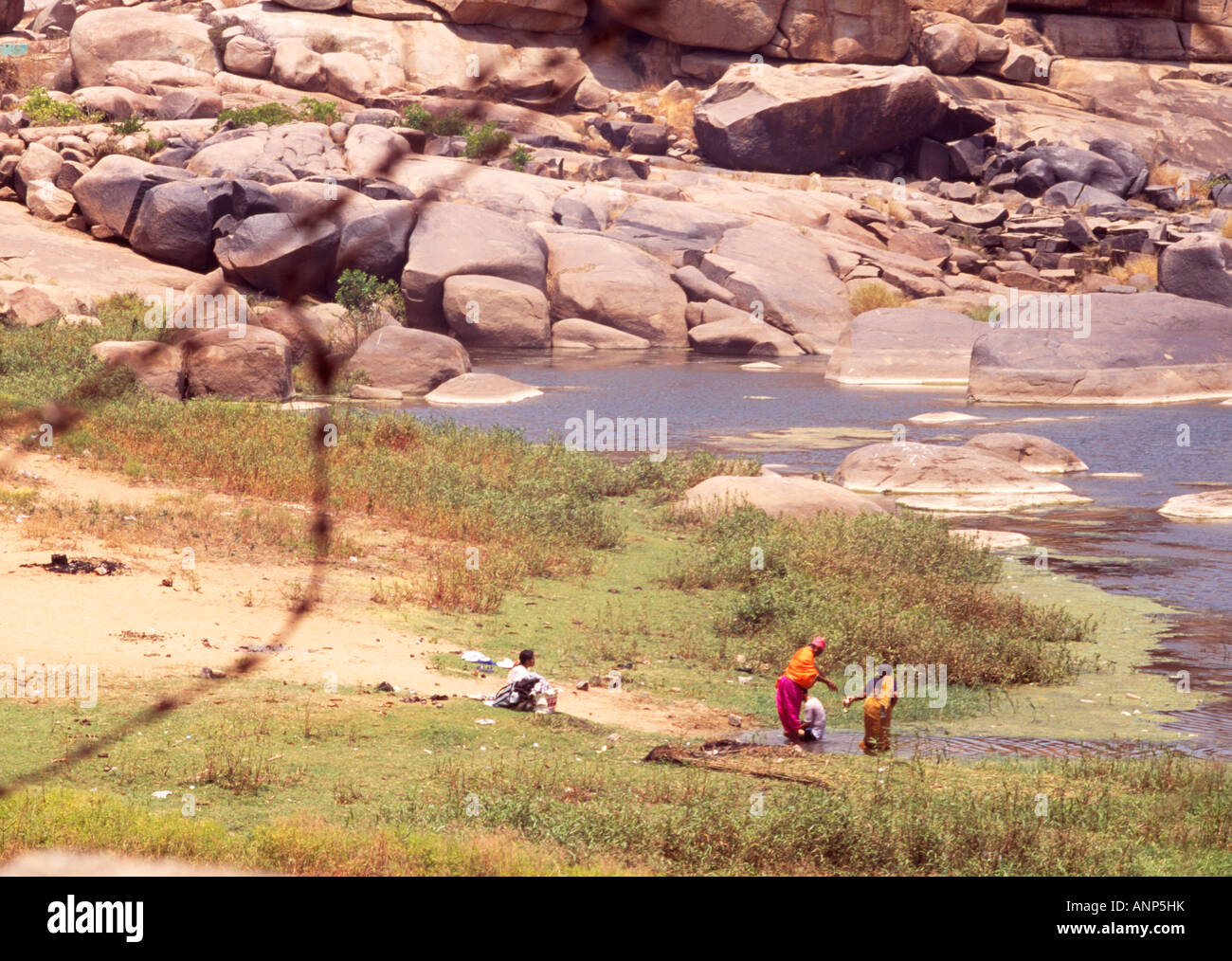 Indian women washing clothes, Hampi, India Stock Photo - Alamy