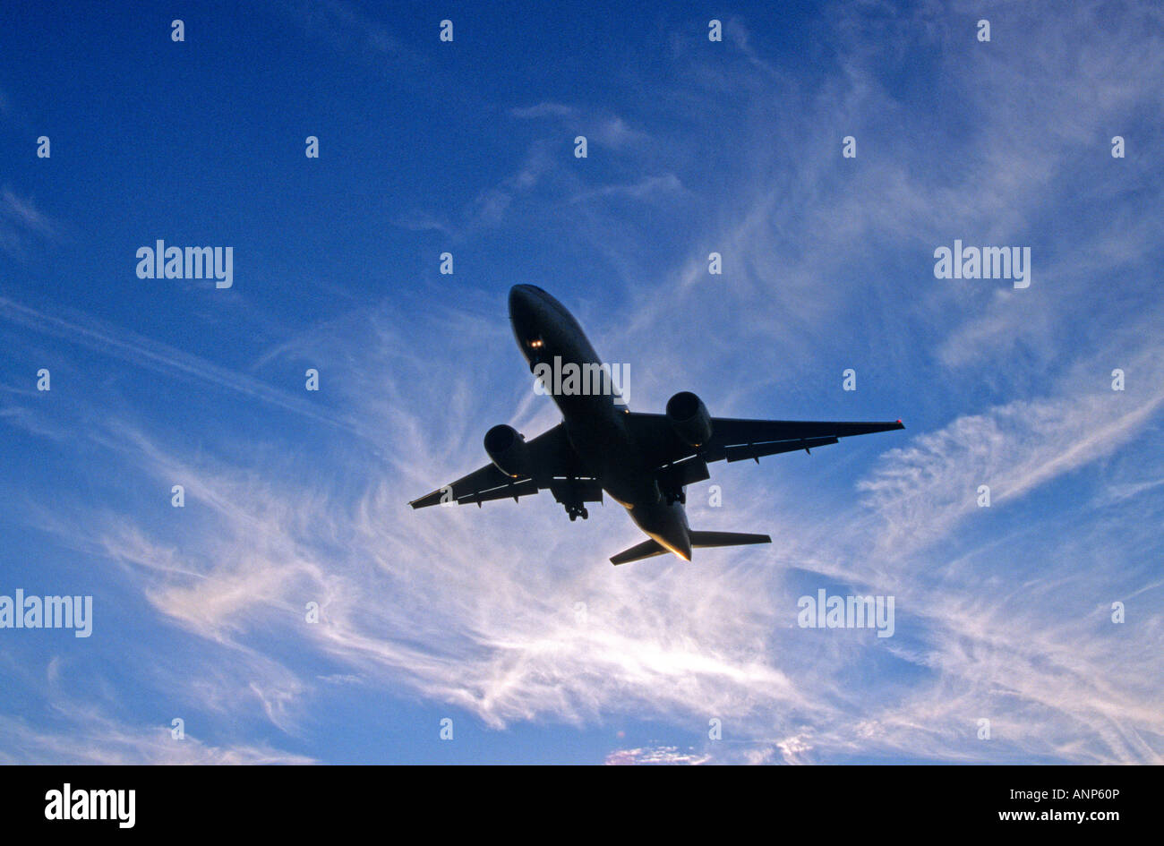 Boeing 777 is Approaching to Land After Sunset Stock Photo - Alamy