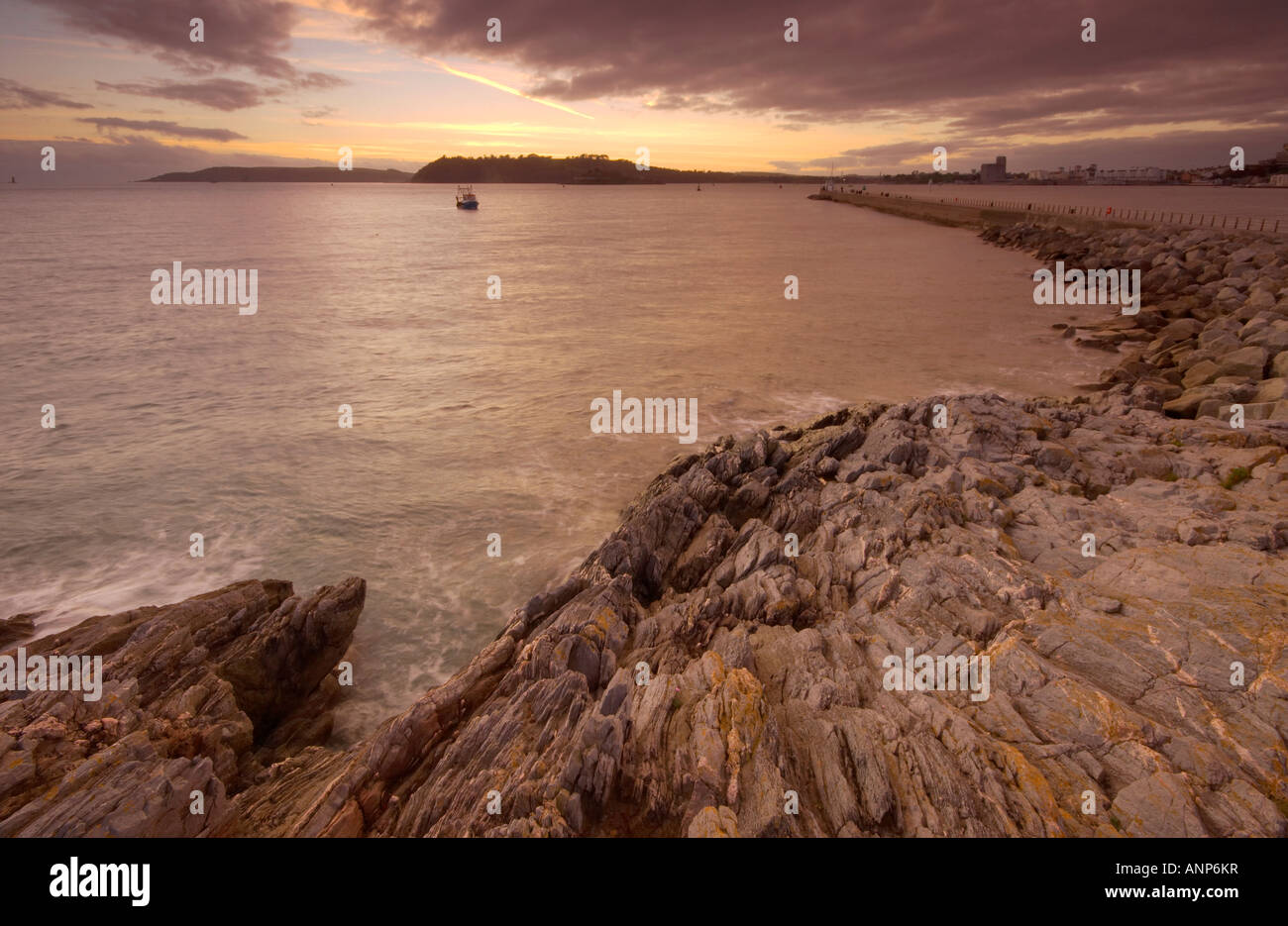 Mountbatten pier against a colourful sunset sky Plymouth Sound Devon UK ...