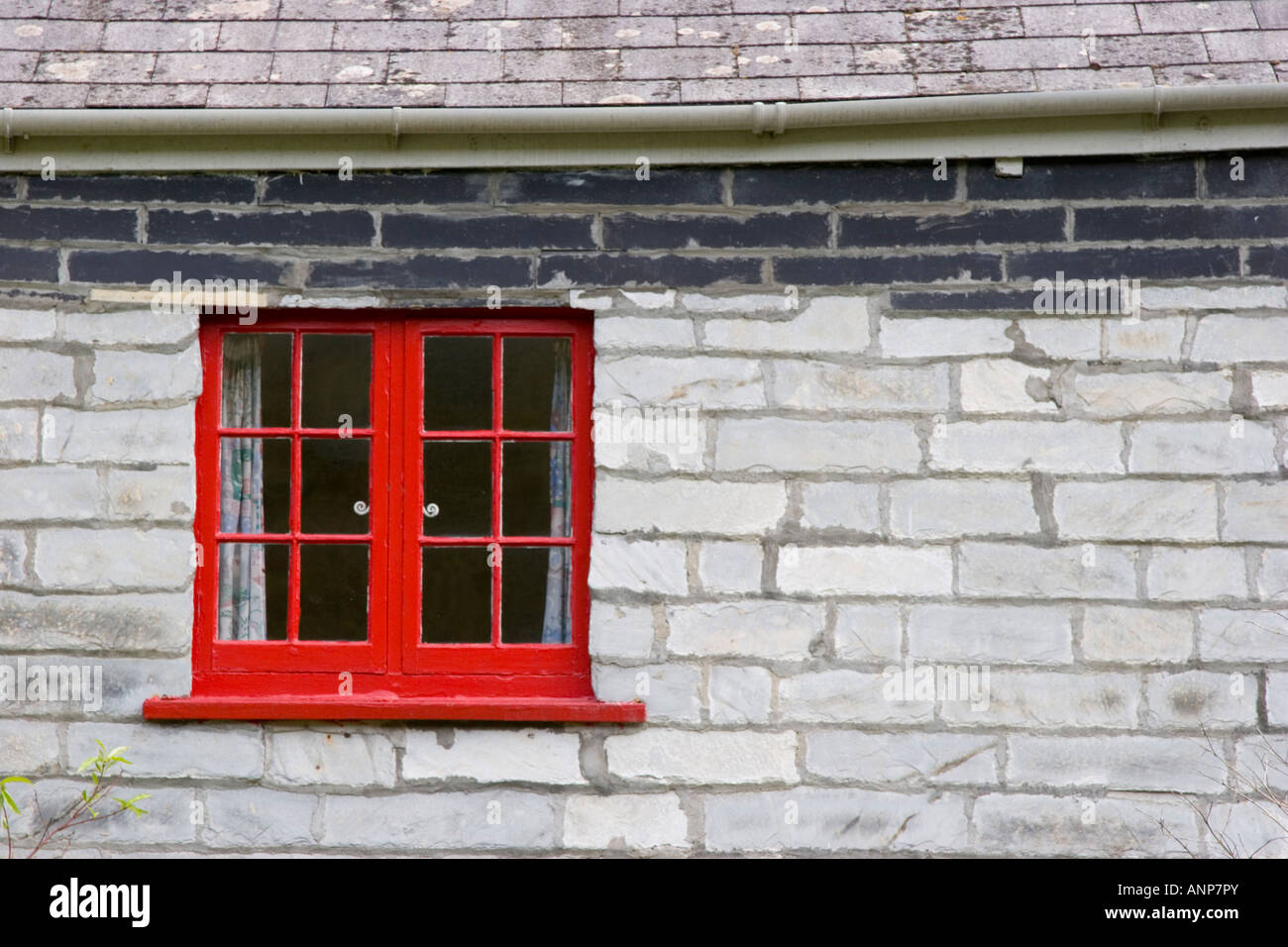 Interesting windows with painted red frames Stock Photo - Alamy