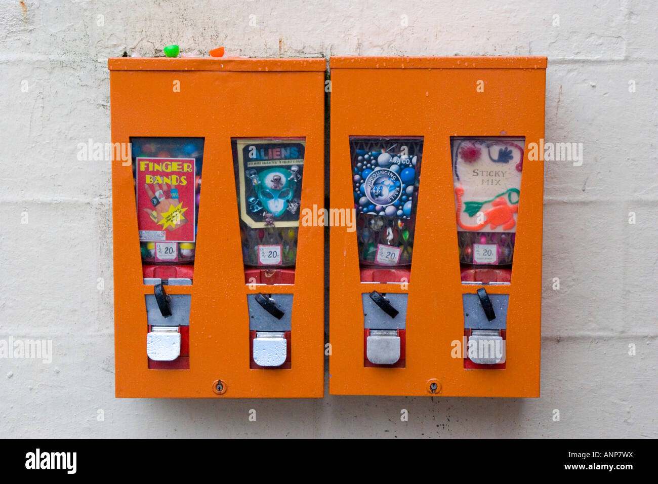 Toy and sweet vending machines with coin operated slots Stock Photo - Alamy