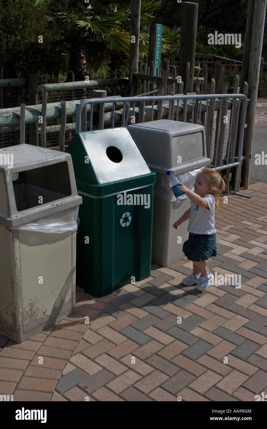 Little Girl Disposing of Garbage Stock Photo - Alamy
